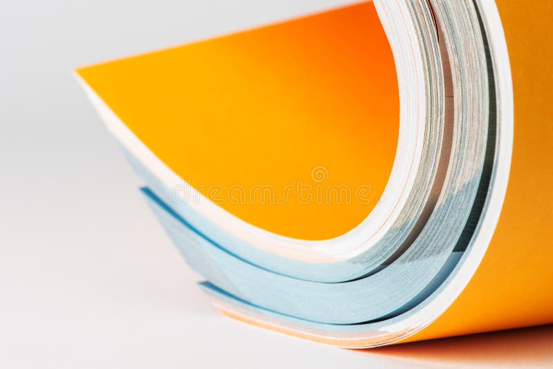 Pages of a rolled up book stock photo. Image of color - 268840350