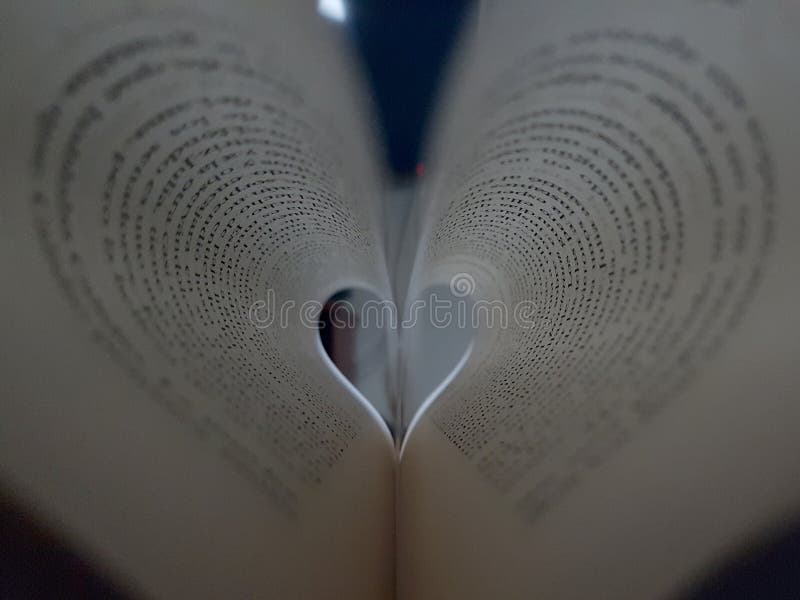 Pages of an Open Book Curved into a Heart Shape Inside with Text in ...