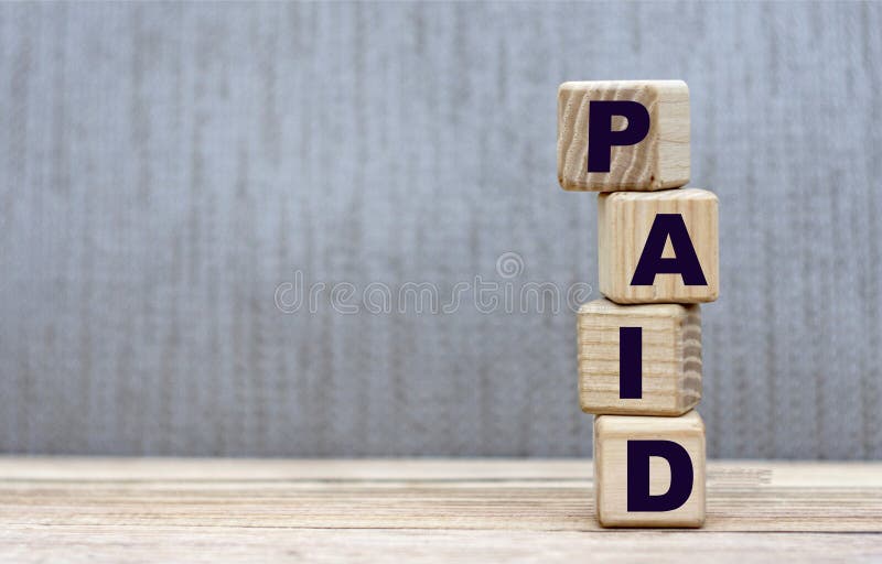 PAID Word on Cubes on a Beautiful Gray Background Stock Image - Image ...