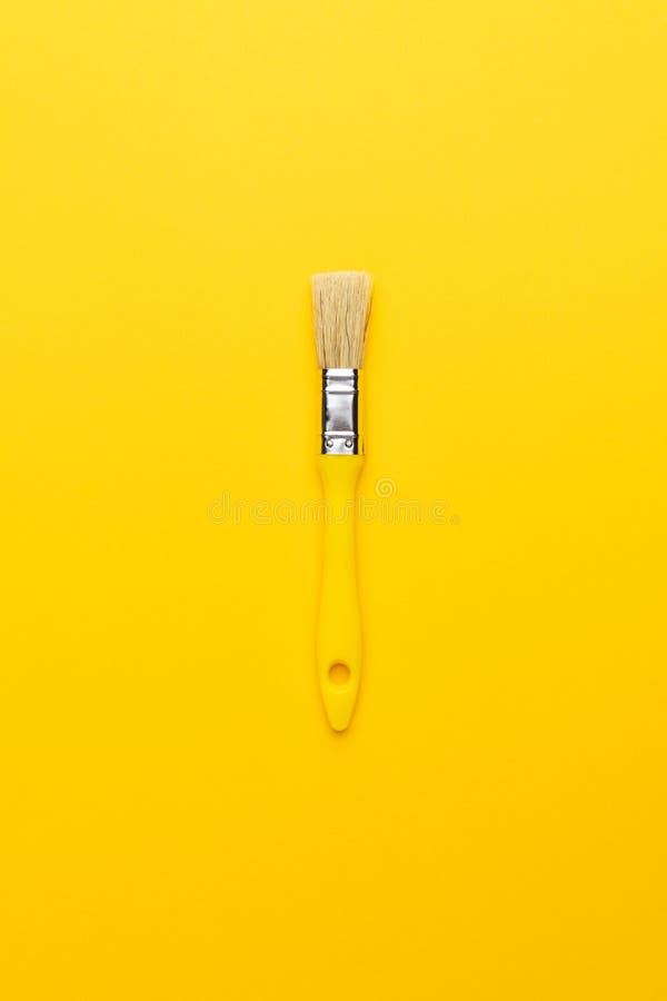 Paint Brush with Yellow Handle on the Yellow Background Stock Image ...