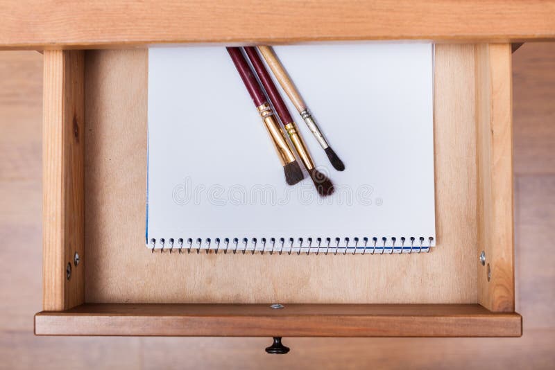 Paint Brushes on Drawing Album in Open Drawer Stock Image - Image of ...