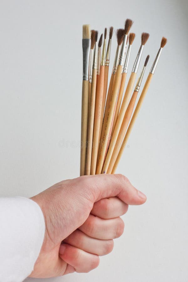 Paint Brushes in Hand. Artist Brushes Stock Photo - Image of museum ...