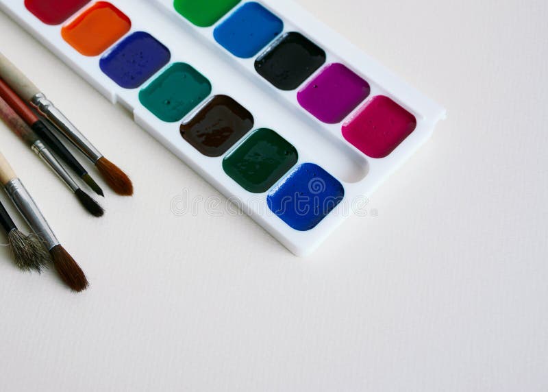 Paint Brushes and a Set of Paints on a White Paper Stock Image - Image ...
