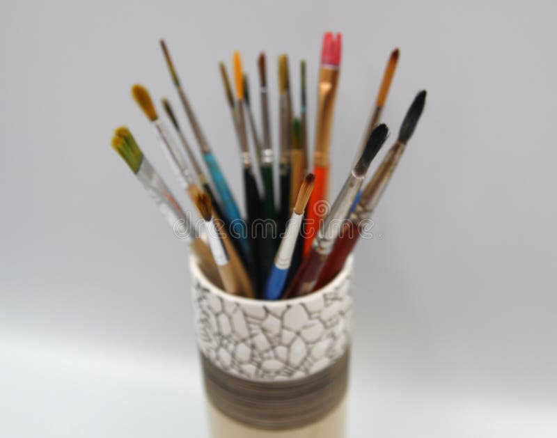 Paint Brushes in Support. Luxurious Glass Full of Different Brushes ...