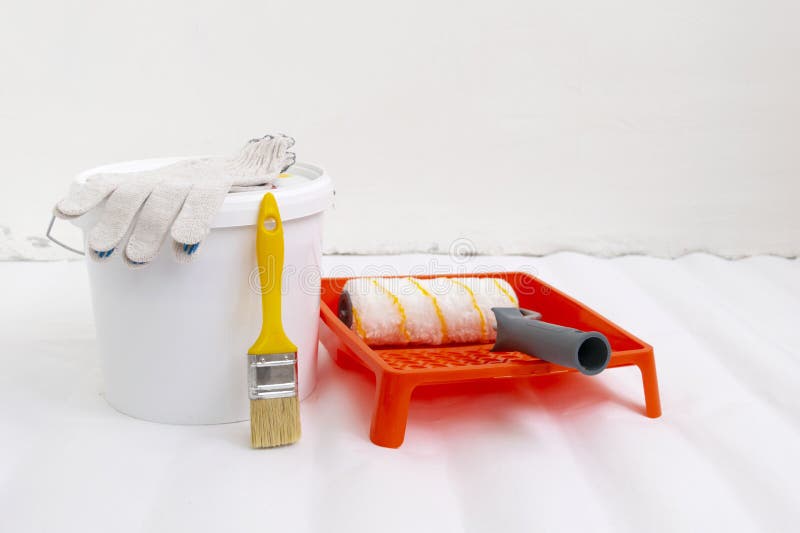 Paint Can, Roller and Paint Tray for Painting Wall on the Floor Stock ...