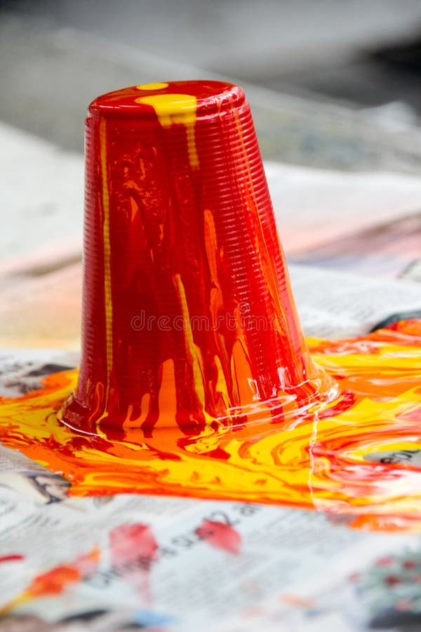 Paint Pouring Out and Spilling on a Paper Stock Photo - Image of liquid ...