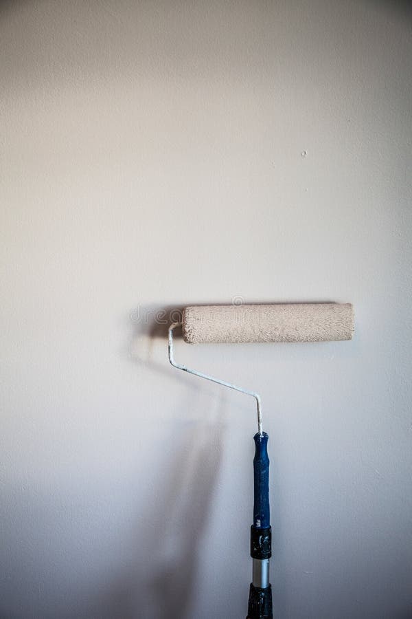 Paint Roller on the Wall stock image. Image of decorating - 45097015