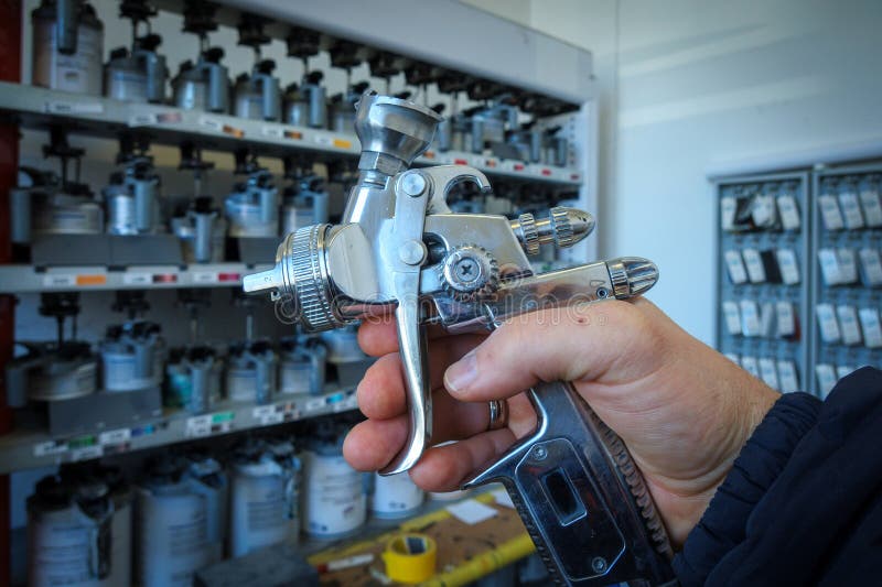 A Paint Spray Gun is Held in the Hand Stock Image - Image of hose ...