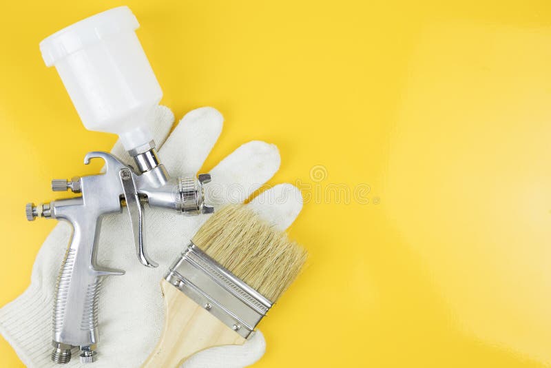 Paint Spray Gun at Work at the Workplace in the Workshop. Stock Photo ...