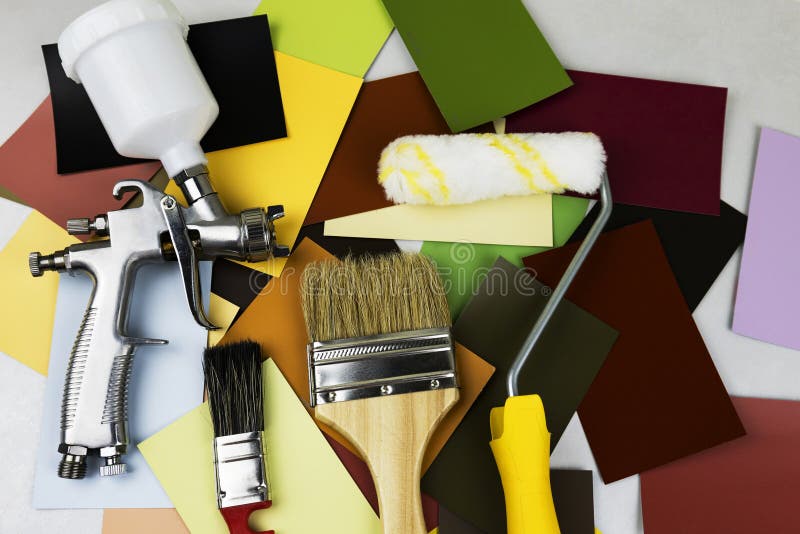 Paint Spray Gun at Work at the Workplace in the Workshop. Paint Brush ...