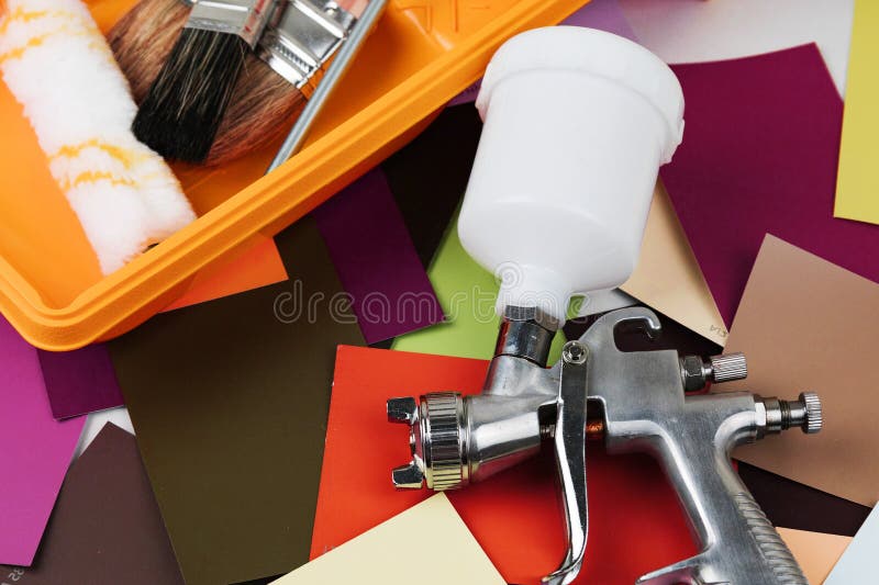 Paint Spray Gun at Work at the Workplace in the Workshop. Paint Brush ...