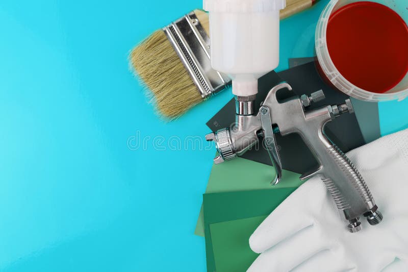 Paint Spray Gun at Work at the Workplace in the Workshop. Paint Brush ...