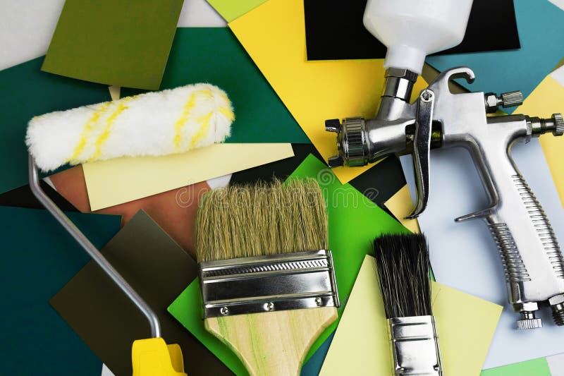 Paint Spray Gun at Work at the Workplace in the Workshop. Paint Brush ...