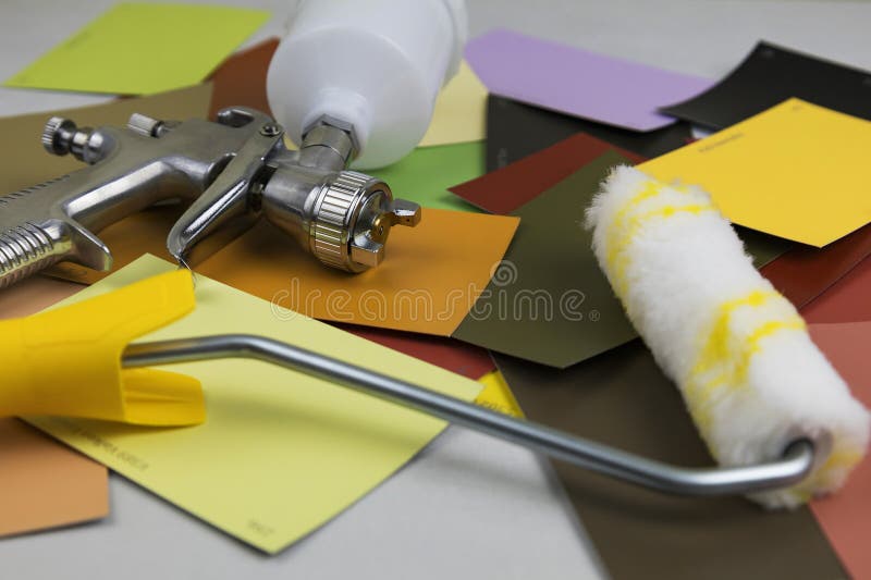 Paint Spray Gun at Work at the Workplace in the Workshop. Paint Brush ...