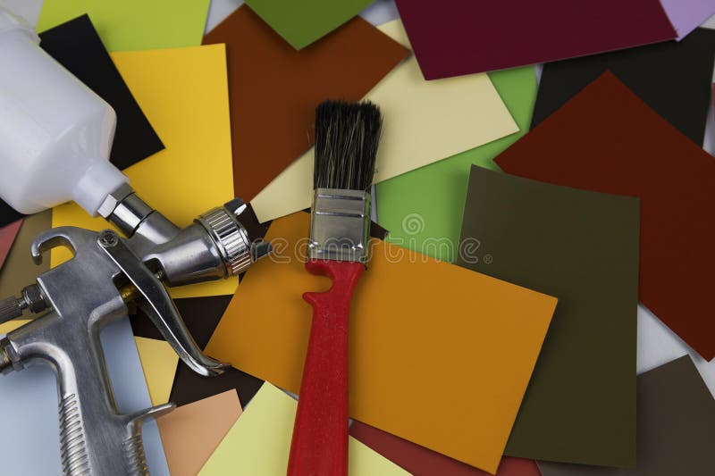 A Paint Spray Gun at Work at the Workplace in the Workshop. Paint ...