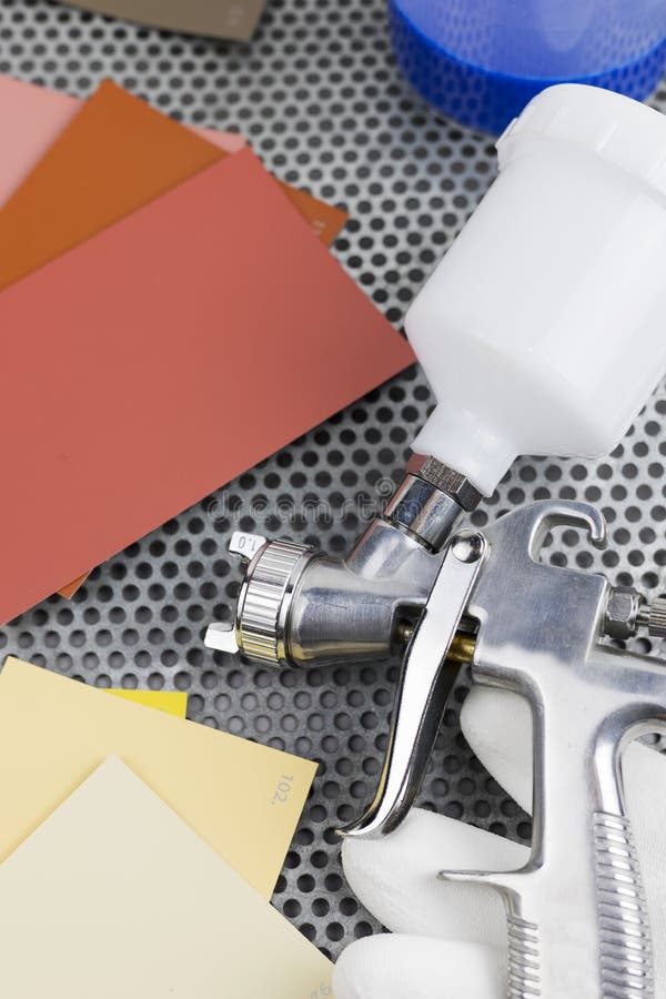 Paint Spray Gun at Work at the Workplace in the Workshop. Stock Photo ...
