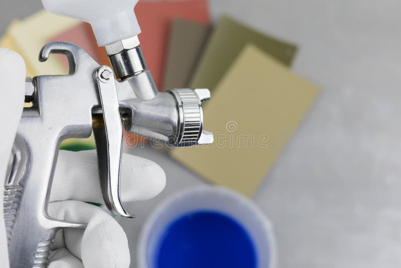 Paint Spray Gun at Work at the Workplace in the Workshop. Stock Image ...