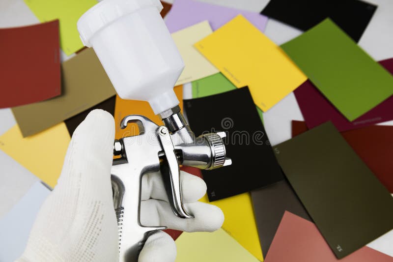 Paint Spray Gun at Work at the Workplace in the Workshop. Stock Photo ...