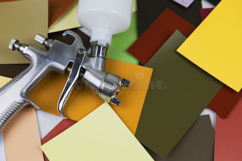 A Paint Spray Gun at Work at the Workplace in the Workshop. Paint ...