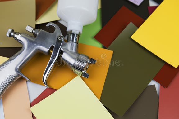 A Paint Spray Gun at Work at the Workplace in the Workshop. Paint ...
