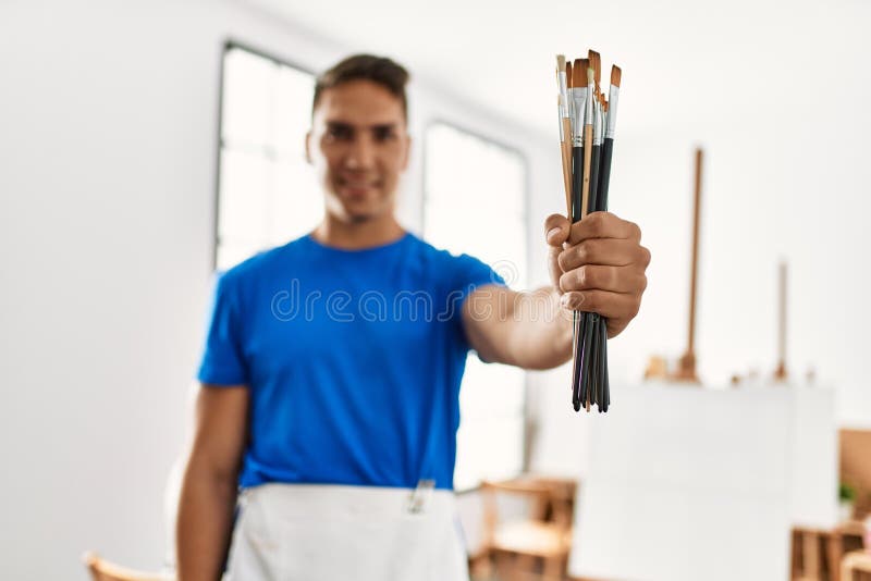 Paint Student Man Smiling Happy Holding Paintbrushes at Art School ...