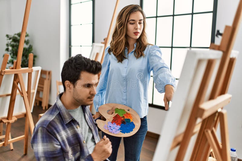 Paint Teacher Teaching To Student at Art School Stock Photo - Image of ...