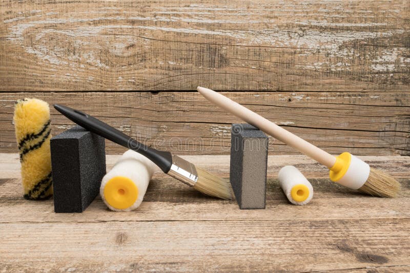 A Paint Tool for Finishing Work on Wooden Background. Stock Image ...