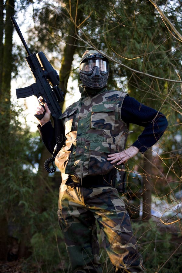 Paintball player shooting stock photo. Image of competitive - 6030314