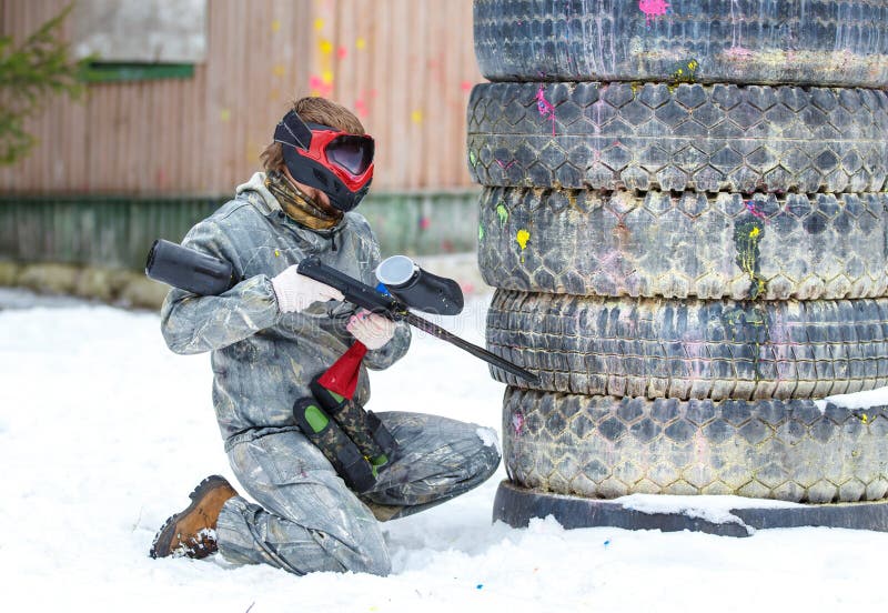 Paintball Game in Winter. Cool Shooter Behind Fortification. Stock ...