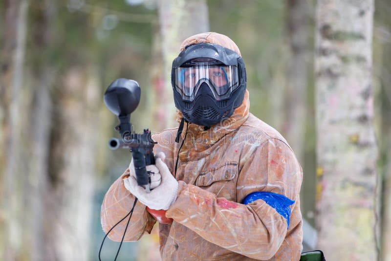 Paintball Game in Winter. Cool Shooter Behind Fortification. Stock ...