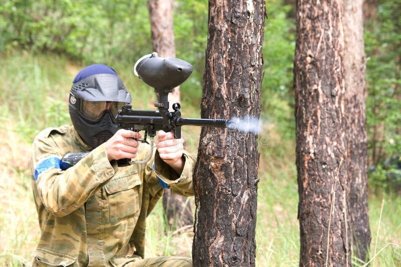 Paintball player shooting stock photo. Image of competitive - 6030314