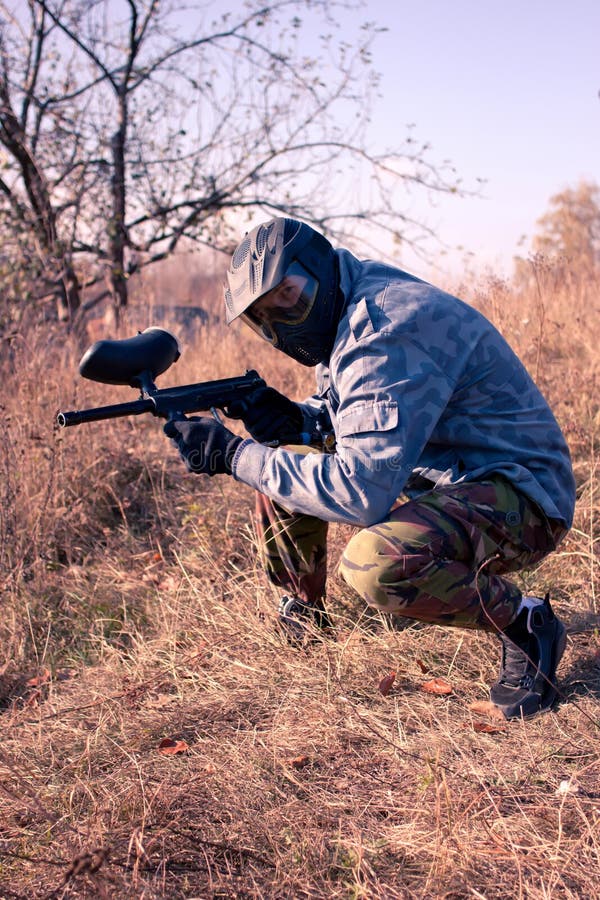 Paintball player shooting stock photo. Image of competitive - 6030314
