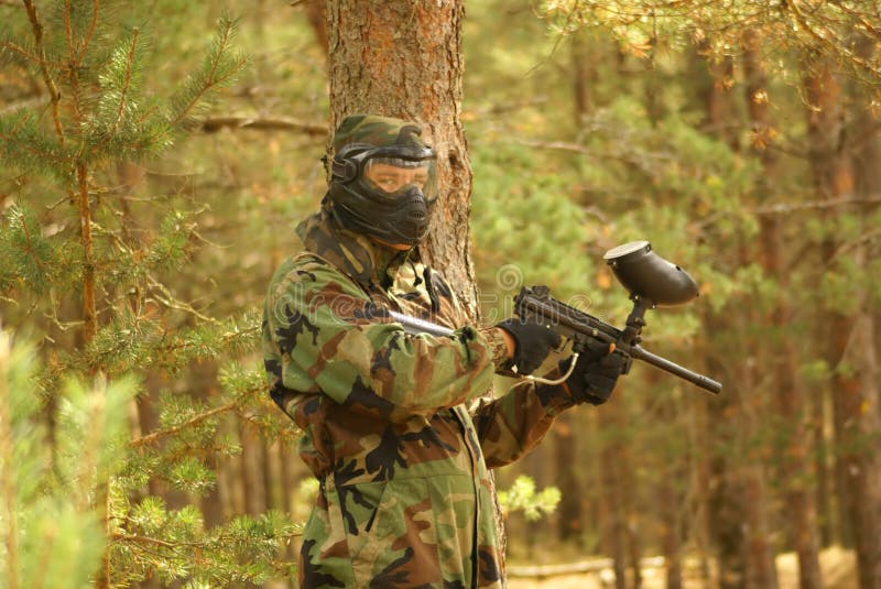 Paintball player shooting stock photo. Image of competitive - 6030314