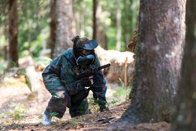 Paintball Player Hide Behind Tree Stock Photo - Image of clothing ...