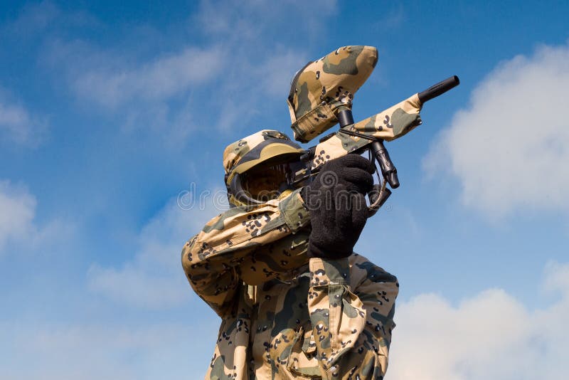 Paintball player shooting stock photo. Image of competitive - 6030314