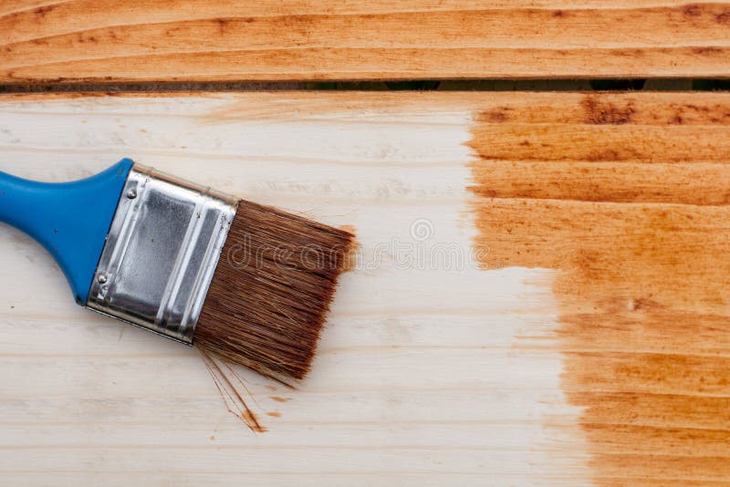 Paintbrush on the Fresh Painted Wooden Planks Board Stock Photo - Image ...