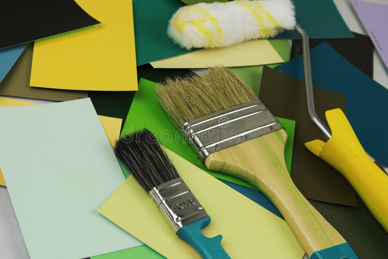 A Paintbrush is Placed on Top of a High Stack of Paint Samples Stock ...
