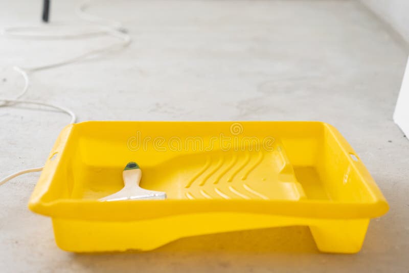 Paintbrush, Roller and Glue Container on Concrete Surface. Composition ...