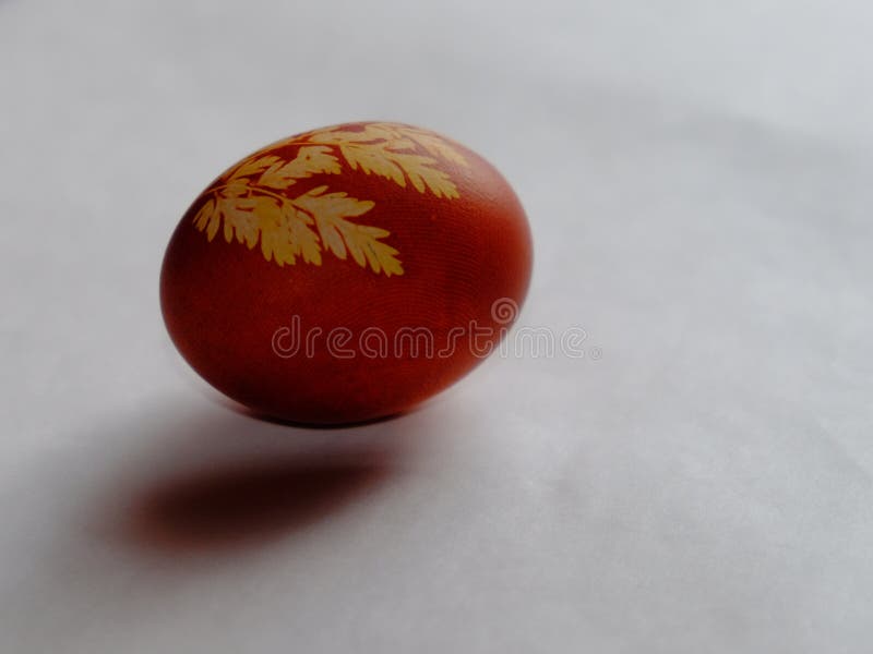 Painted Easter Egg on a White Background. Floral Pattern on a Red ...