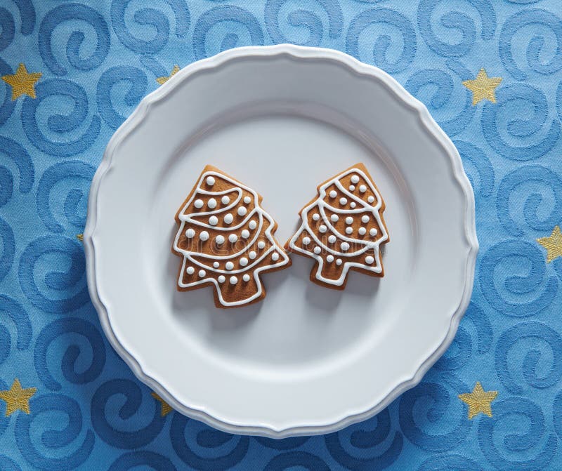 Painted Gingerbread Cookies in the Shape of a Christmas Tree on a Plate ...