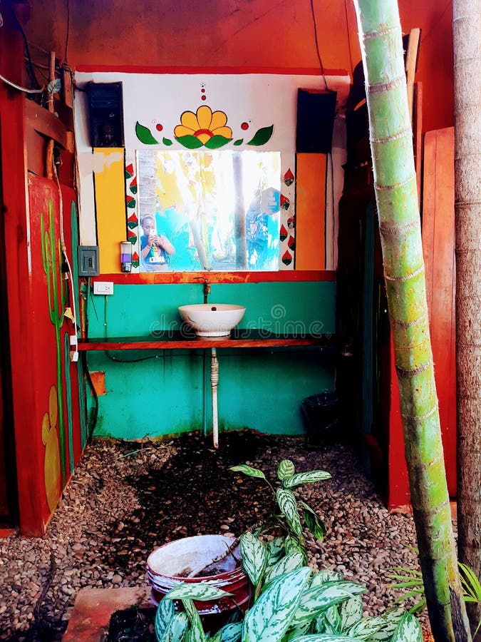 Painted Mural in Outdoor Sink with Palm Trees and Greenery Stock Photo ...