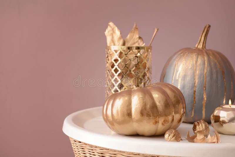 Painted Pumpkins on Table Near Color Wall Stock Photo - Image of ...