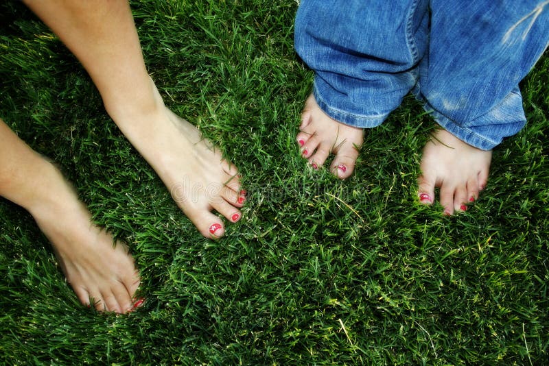 Painted toes on grass stock photo. Image of feet, jeans - 2932144