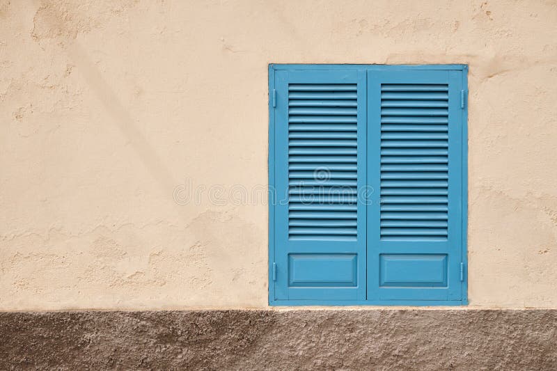 A Painted White Wall with a Blue Window. Stock Image - Image of ...