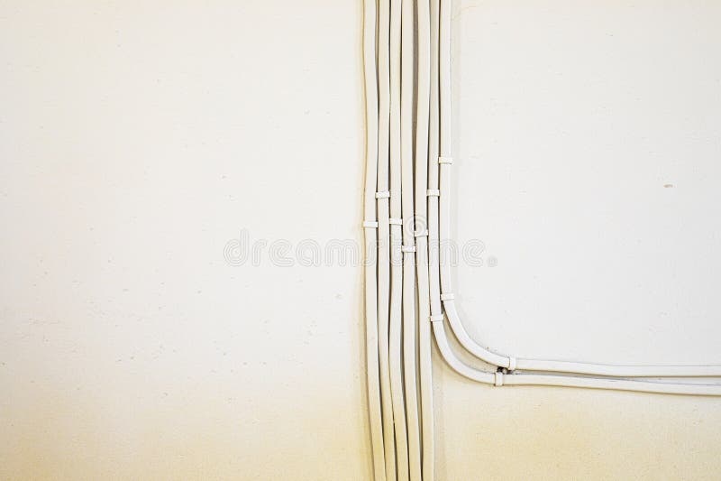 Painted Wires Fixed To a White Wall in a Light Stock Image - Image of ...