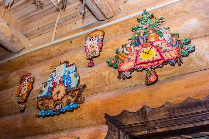 Painted Wooden Wall Clock on Log Wall Stock Image - Image of december ...