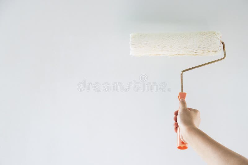 Painter Arm Painting a Wall with Paint Roller Stock Image - Image of ...
