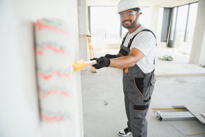 Painter Doing Painting Work on Wall with Roller. Concept of Hard ...