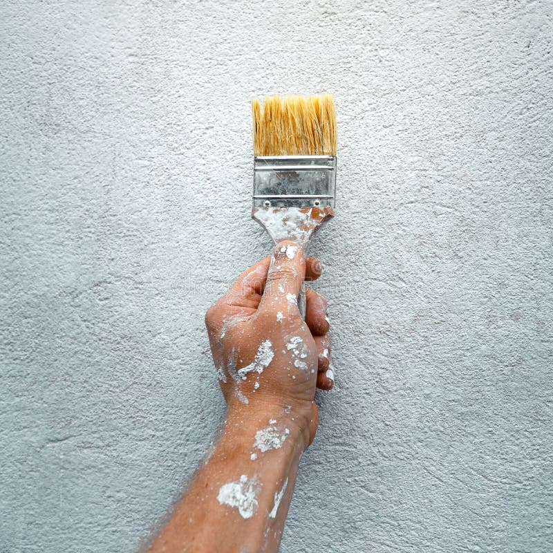 Painter Hand Paints the Wall with Paint, Close-up with Copy-Space. Home ...