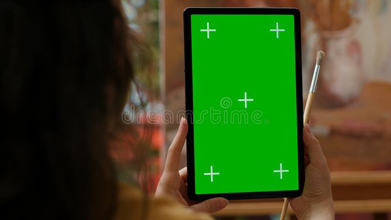 Painter Holding a Device with Isolated Mockup Screen in Her Art Studio ...
